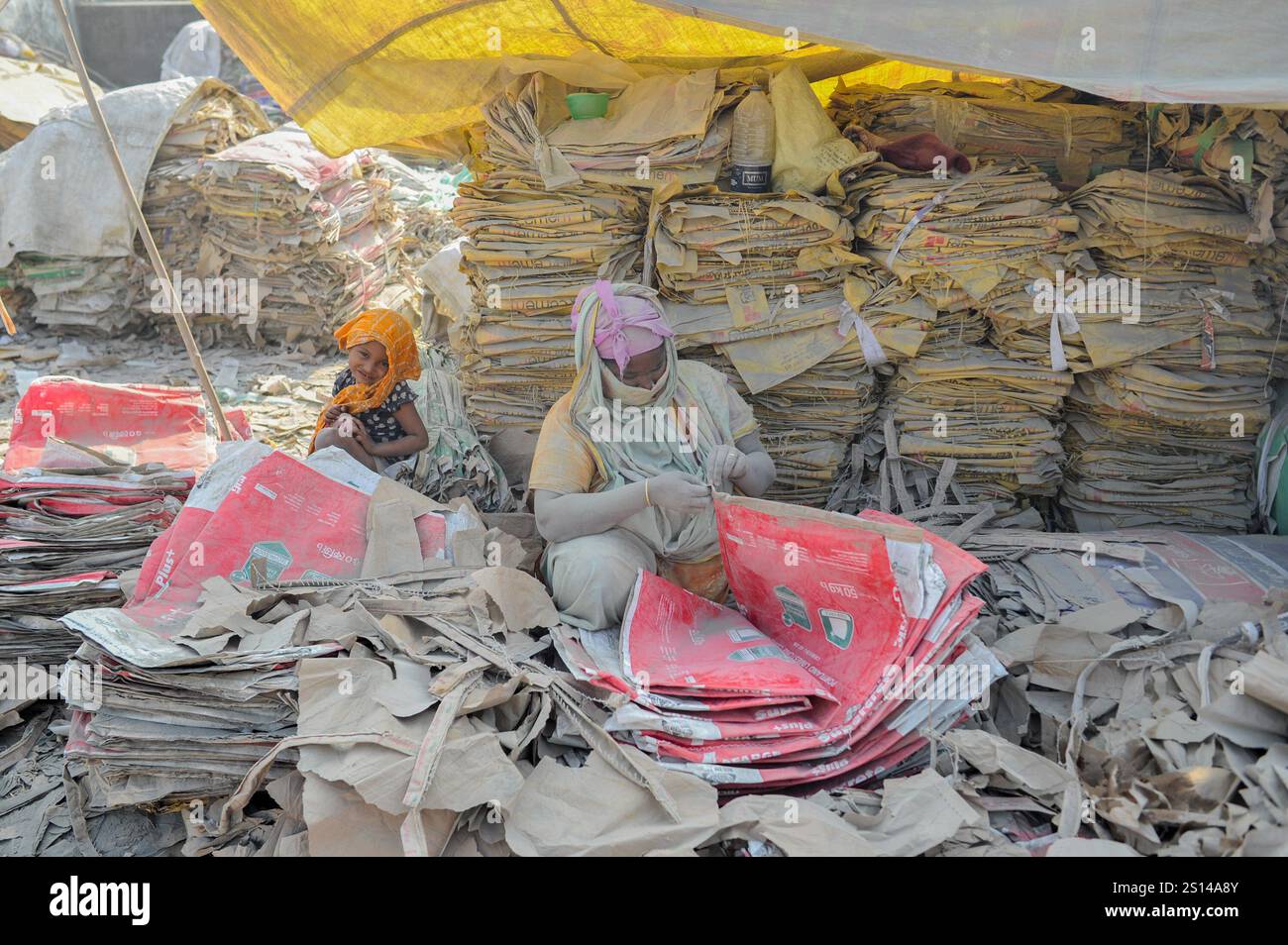 Workers are risking their lives to wash cement bags in the water of ...