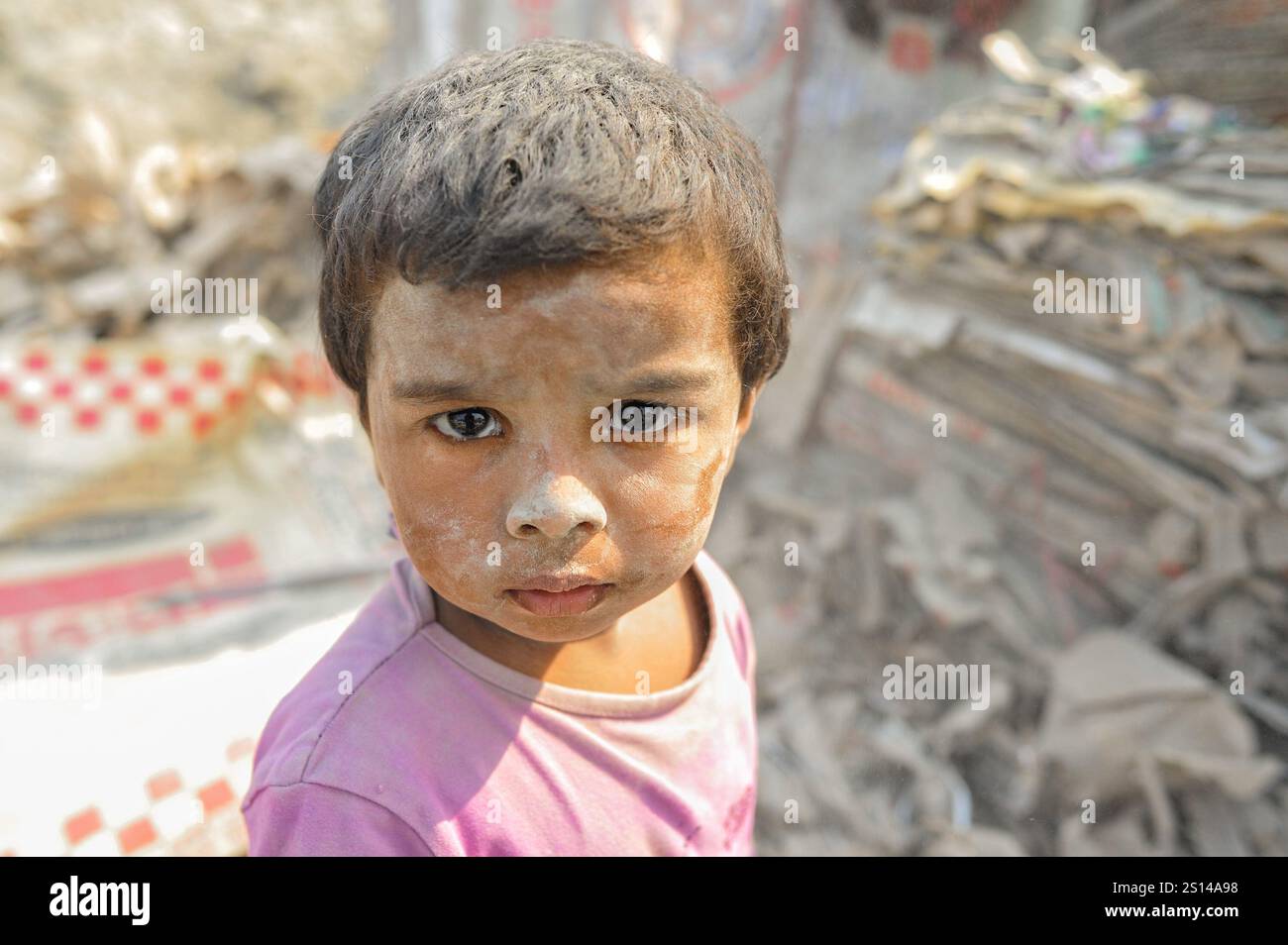 A portrait of a child accompanying her mother, both risking their lives ...