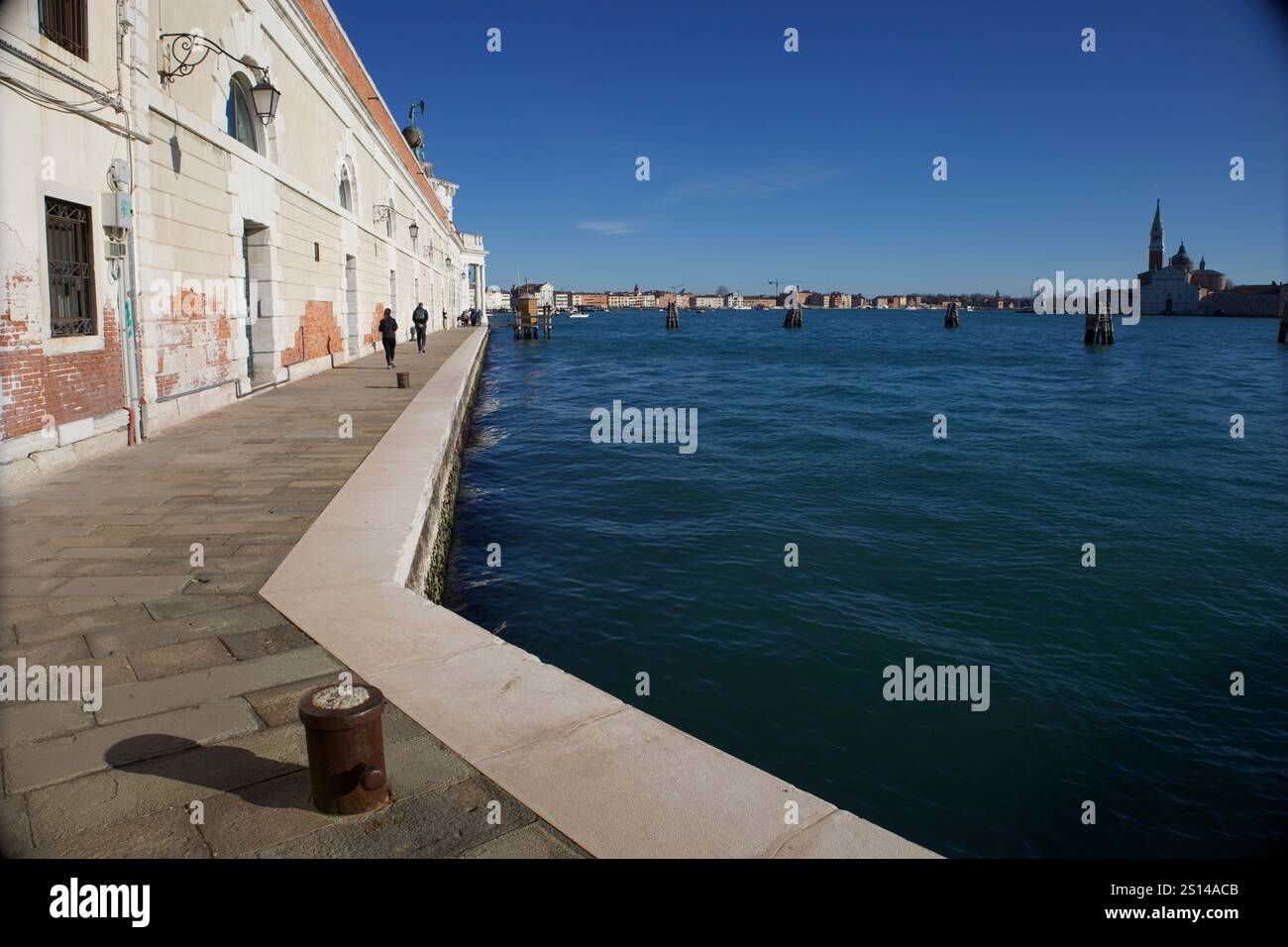 Venice, Italy. December 26, 2024. The stone edges of Venice streets ...