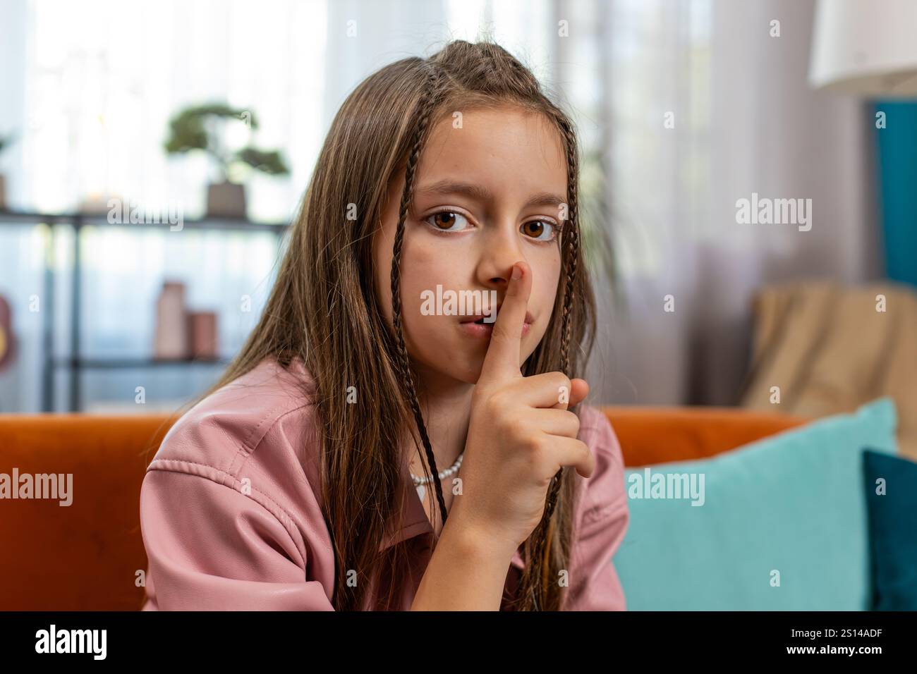 Shh be quiet please. Portrait of preteen girl child presses index ...
