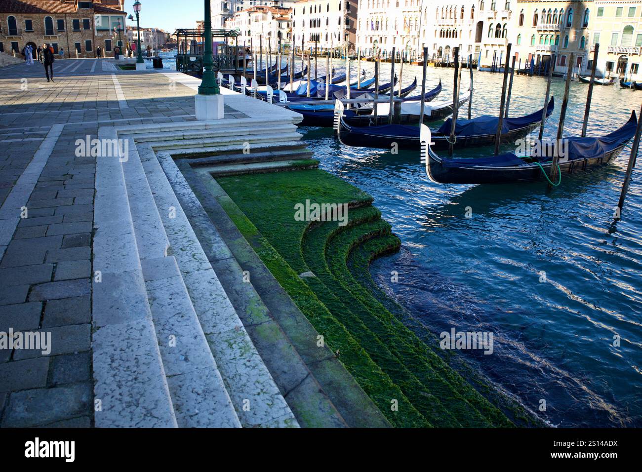 Venice, Italy. December 26, 2024. The stone edges of Venice streets and ...