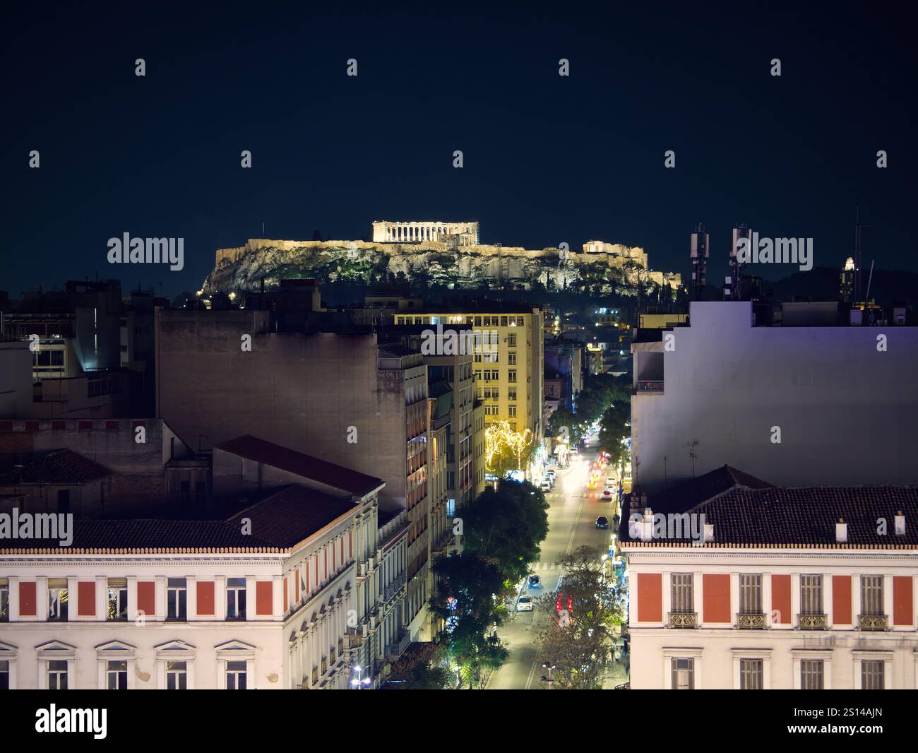 Nighttime cityscape of Athens with illuminated Acropolis atop hill ...