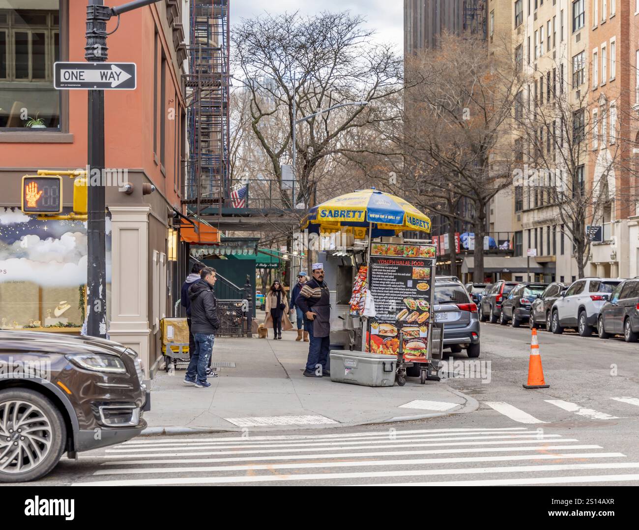 cityscape of an upper east side food vendor on a nyc street corner ...