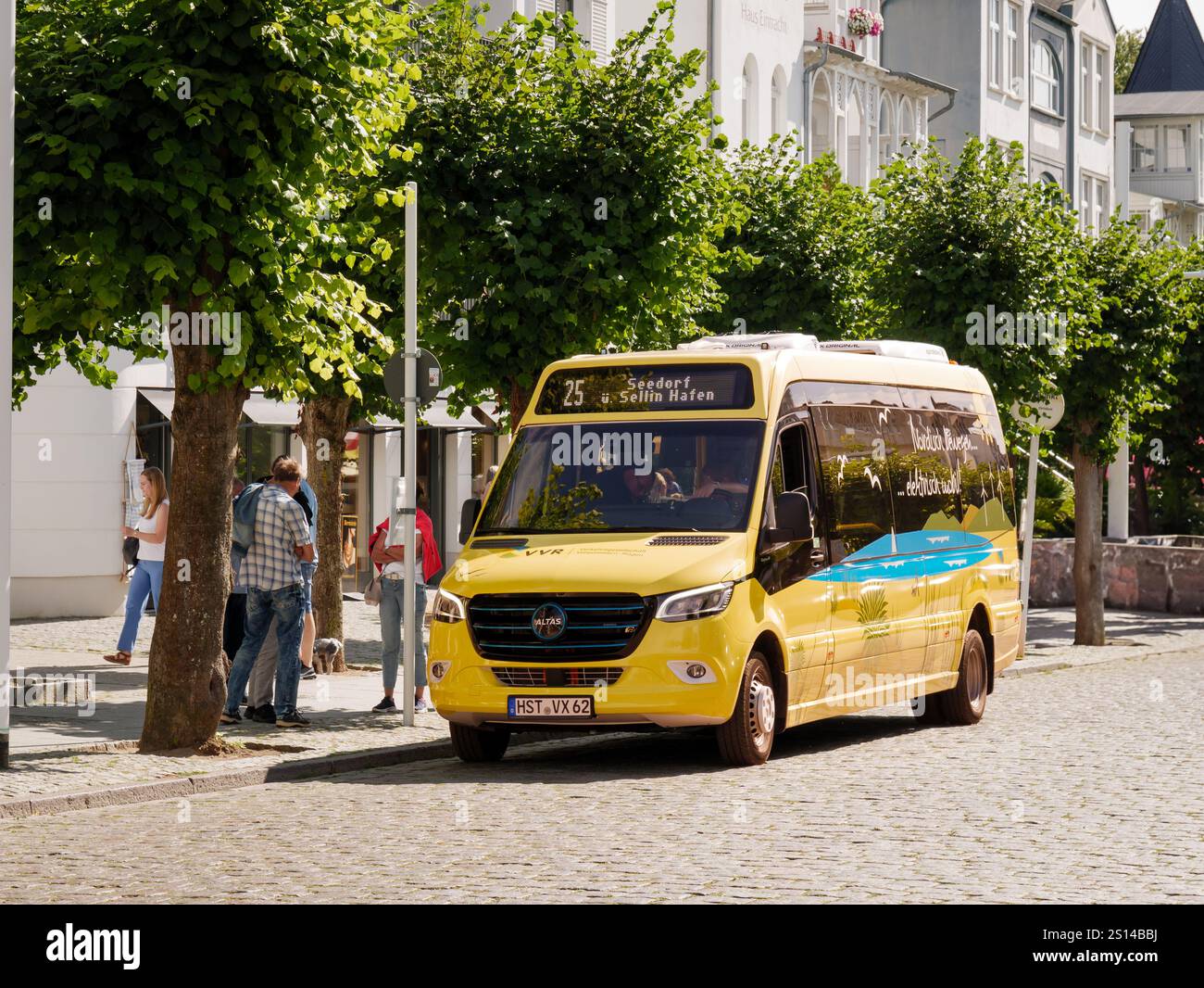 Minibus with passengers at busstop in Wilhelmstrasse in downtown Sellin ...