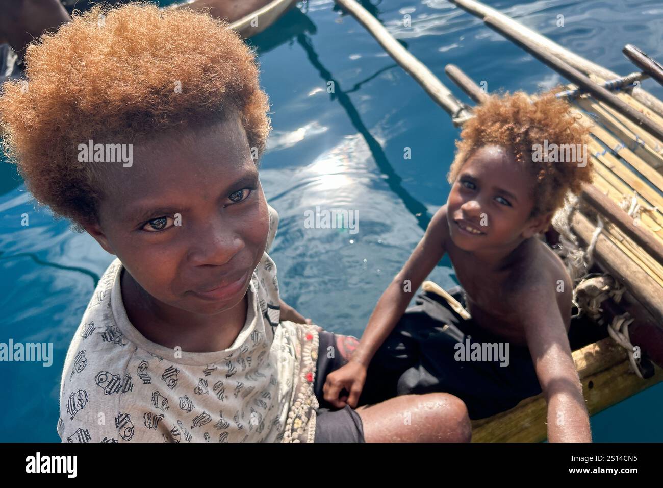 Residents of Vitu Islands in their traditional dugout canoes, Garove ...