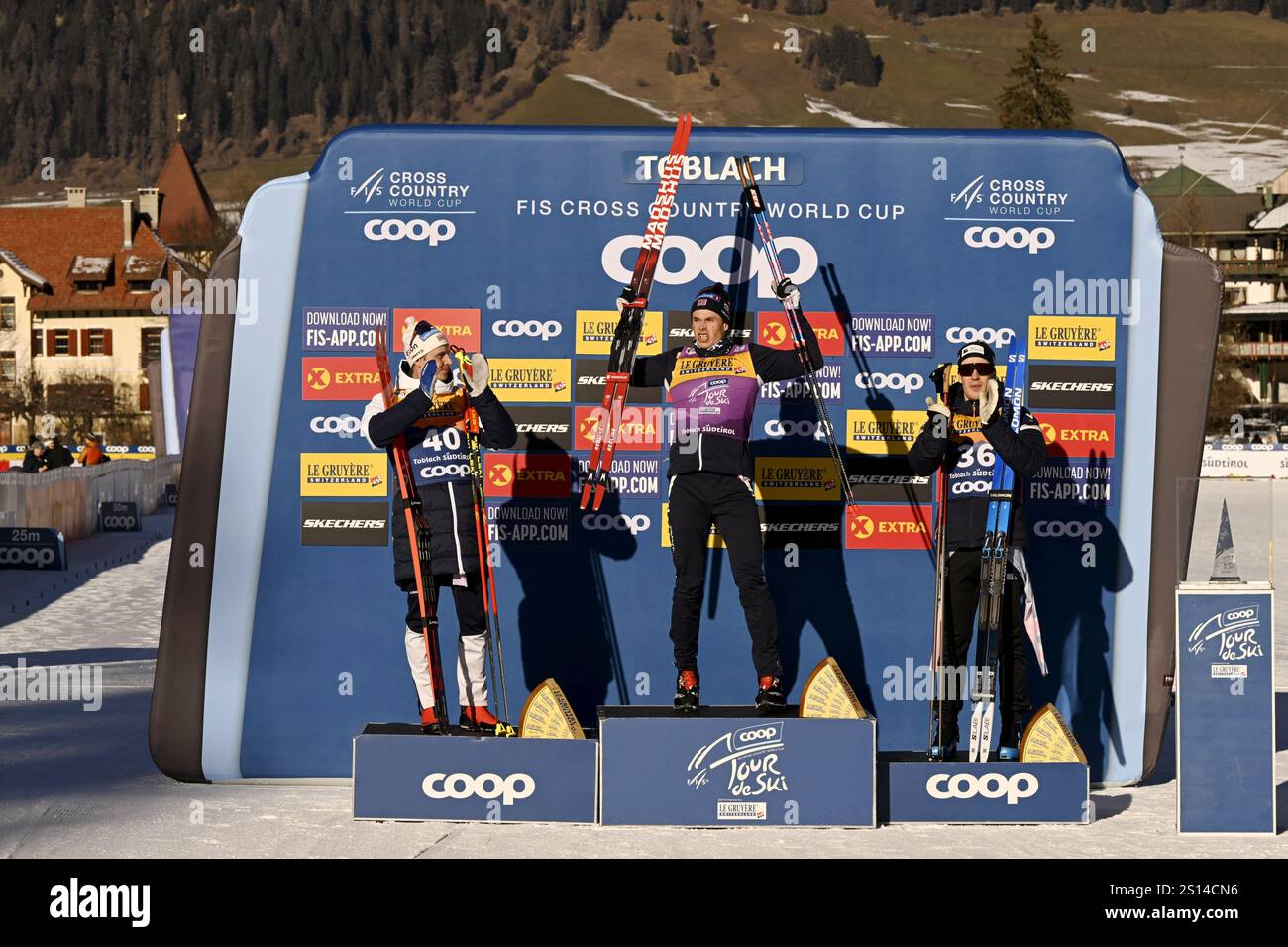 Toblach, Italy. 31st Dec, 2024. Winner Harald Ostberg Amundsen of Norway (C), second placed ...