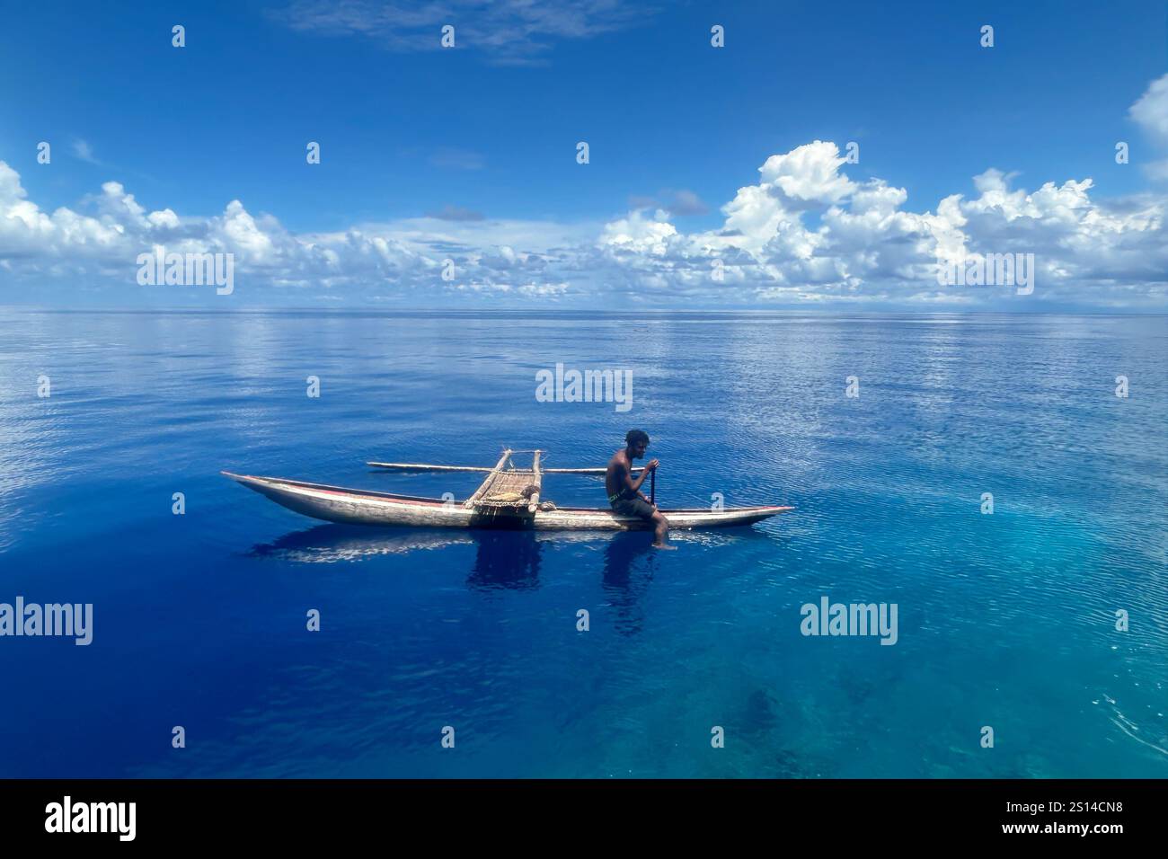 Resident of Vitu Islands in their traditional dugout canoes, Lama ...