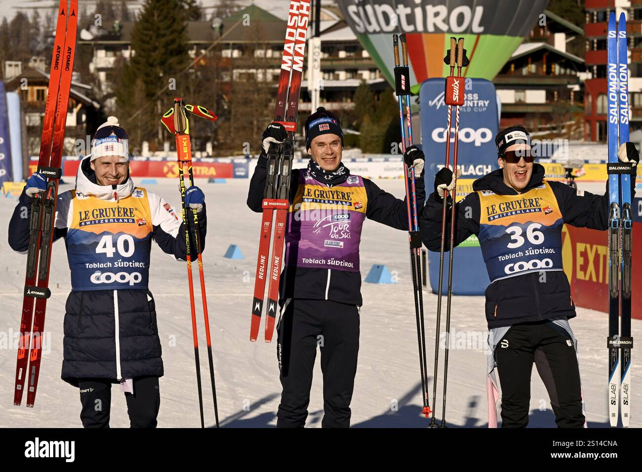 Toblach, Italy. 31st Dec, 2024. Winner Harald Ostberg Amundsen of Norway (C), second placed ...