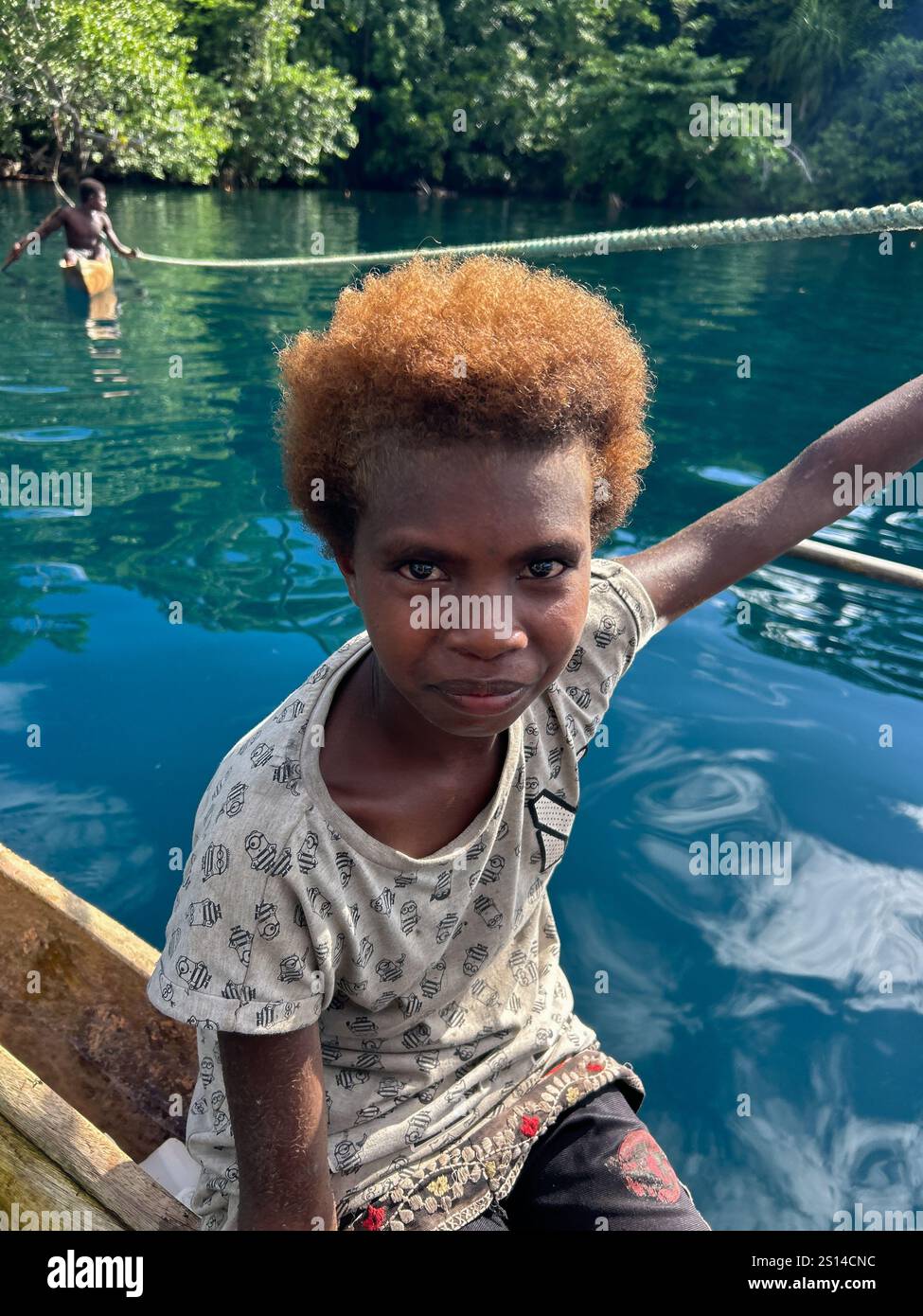 Residents of Vitu Islands in their traditional dugout canoes, Garove ...