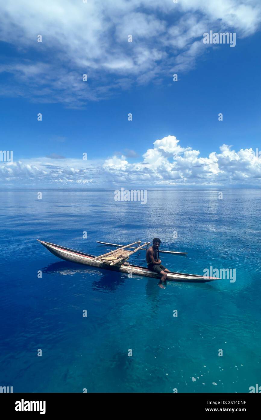 Resident of Vitu Islands in their traditional dugout canoes, Lama ...