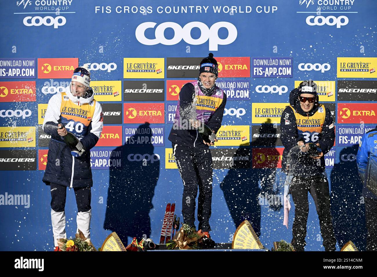 Toblach, Italy. 31st Dec, 2024. Winner Harald Ostberg Amundsen of Norway (C), second placed ...