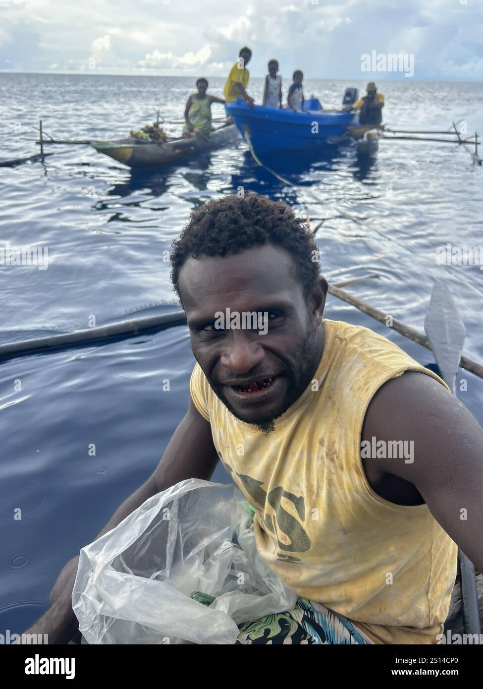 Residents of New Hanover island in their traditional dugout canoes, New ...