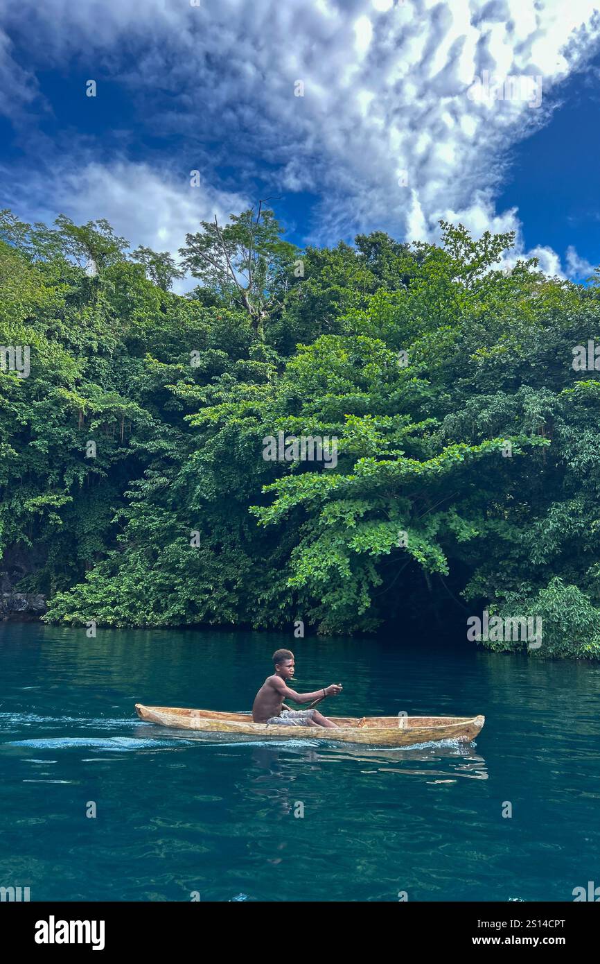 Residents of Vitu Islands in their traditional dugout canoes, Garove ...