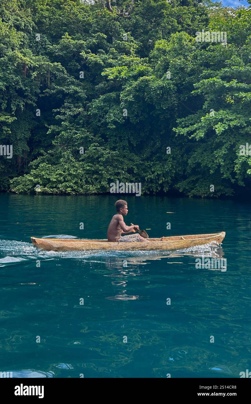 Residents of Vitu Islands in their traditional dugout canoes, Garove ...