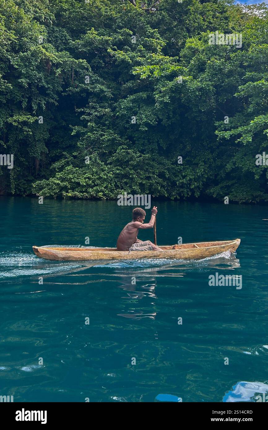Residents of Vitu Islands in their traditional dugout canoes, Garove ...