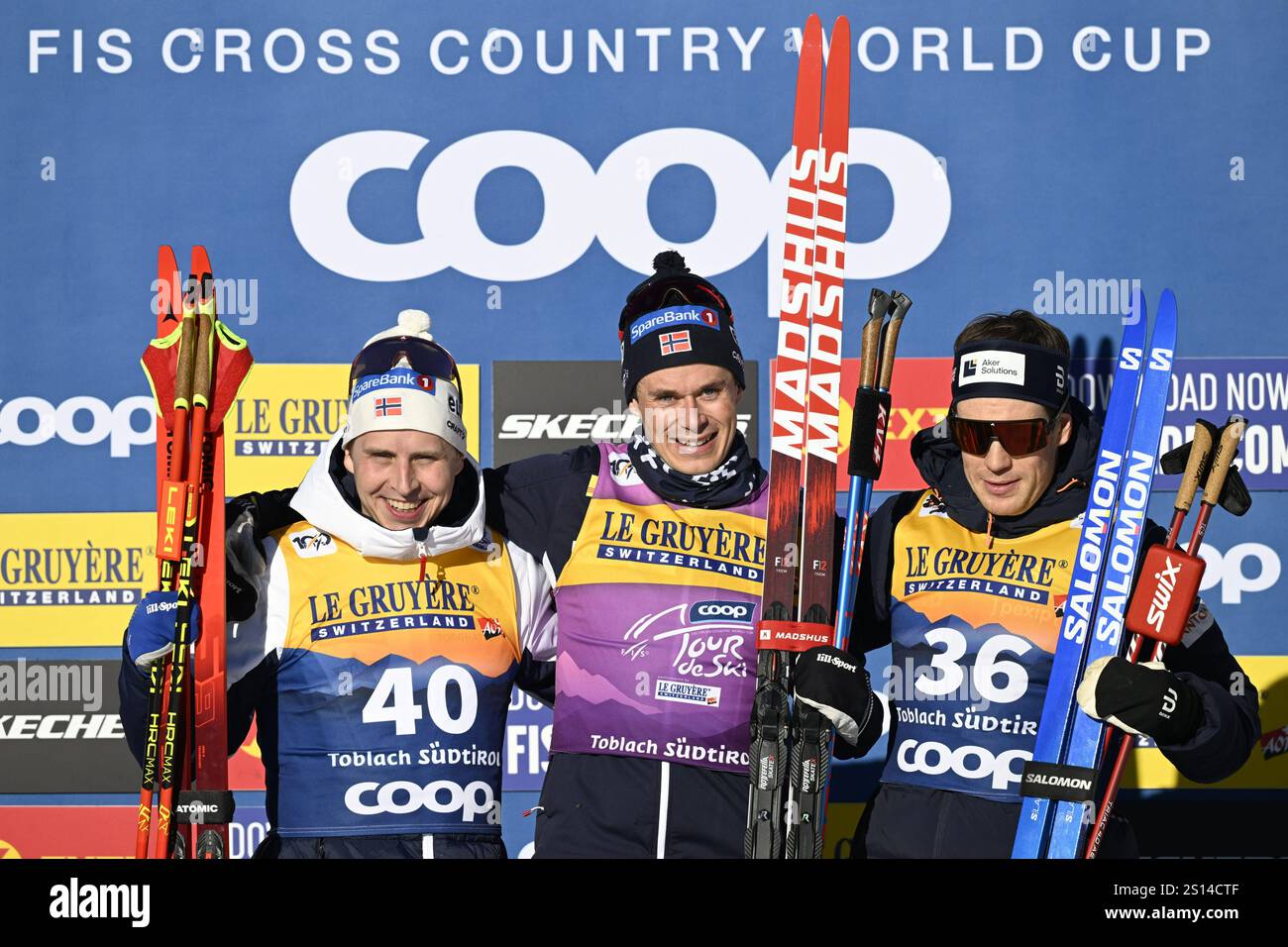 Toblach, Italy. 31st Dec, 2024. Winner Harald Ostberg Amundsen of Norway (C), second placed ...