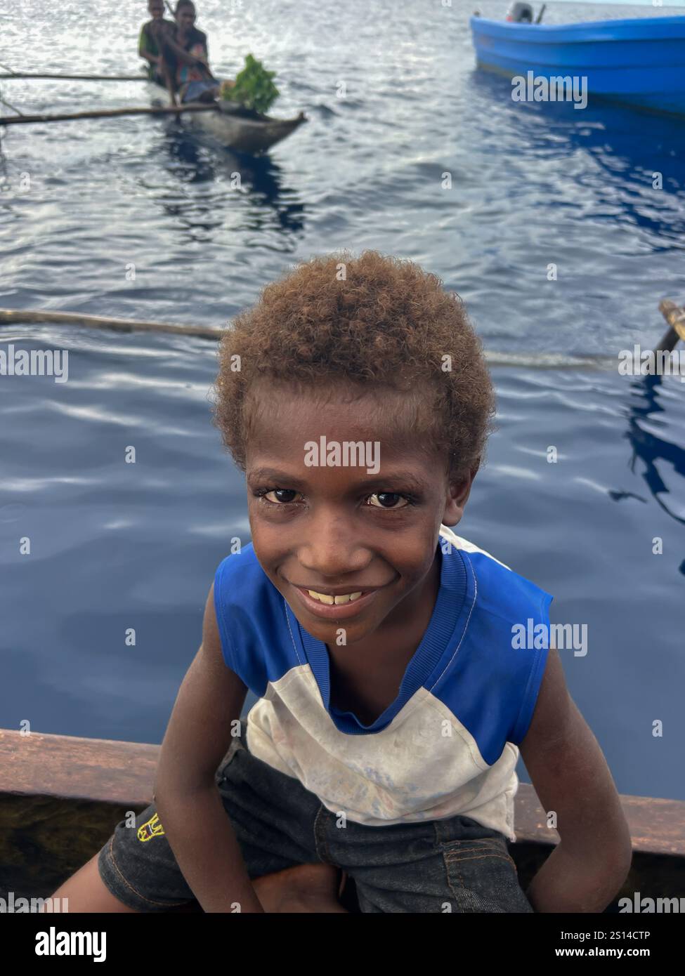 Residents of New Hanover island in their traditional dugout canoes, New ...