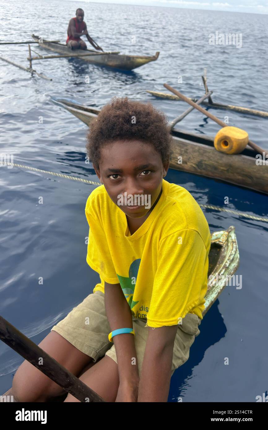 Residents of New Hanover island in their traditional dugout canoes, New ...