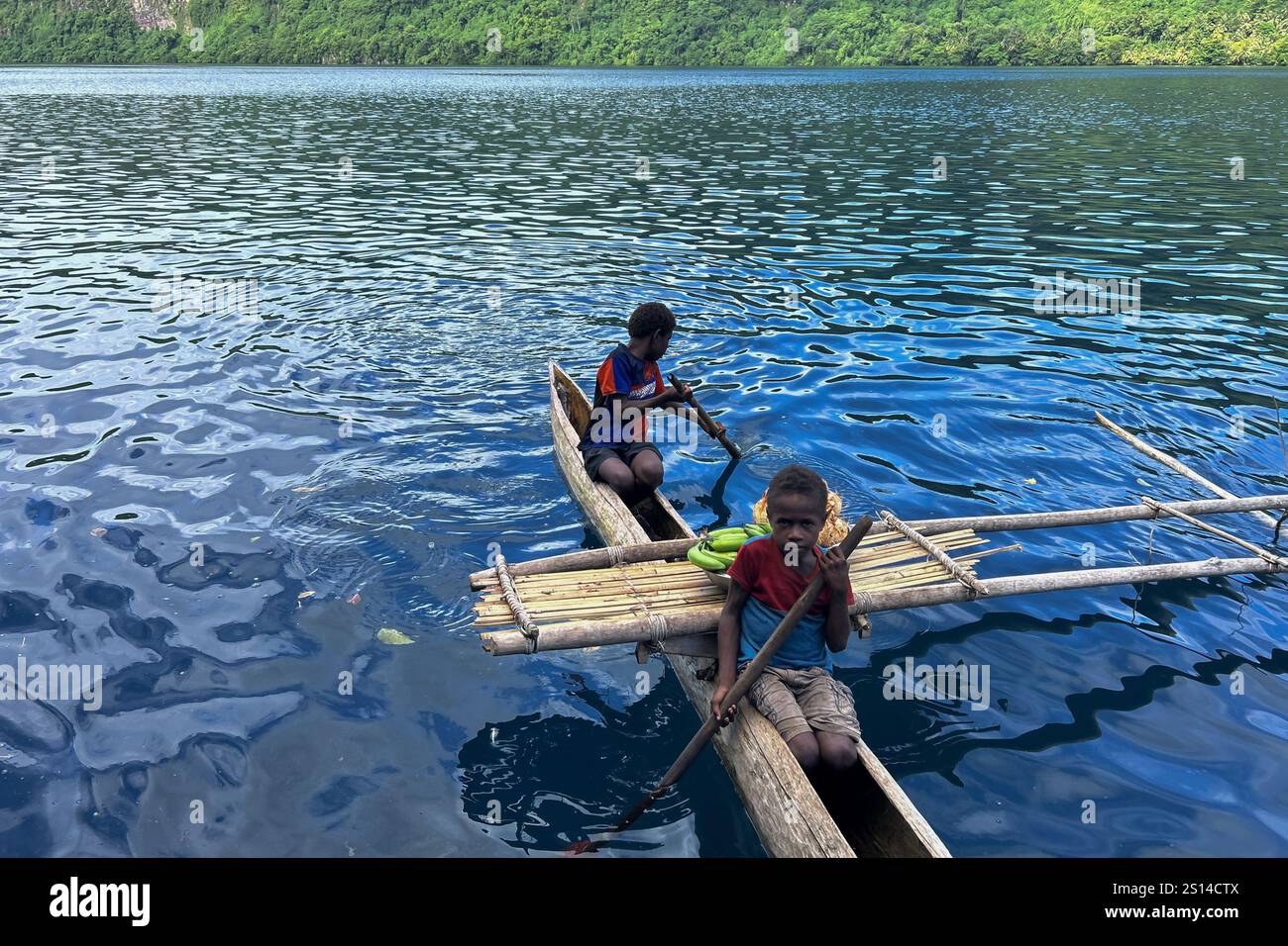 Residents of Vitu Islands in their traditional dugout canoes, Garove ...