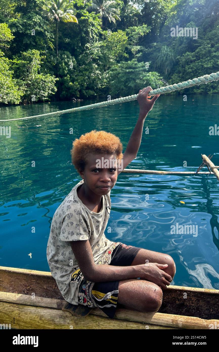 Residents of Vitu Islands in their traditional dugout canoes, Garove ...