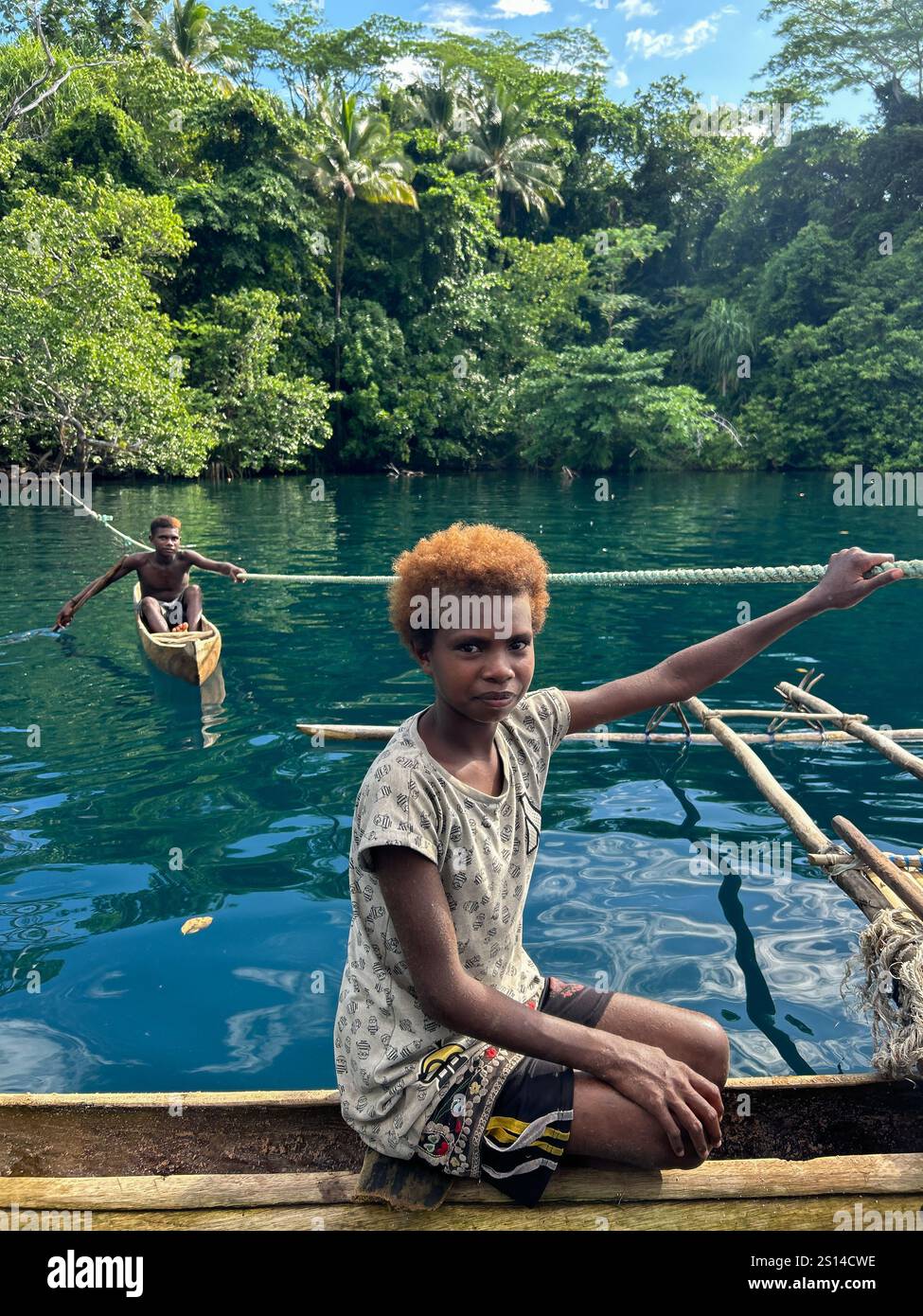 Residents of Vitu Islands in their traditional dugout canoes, Garove ...