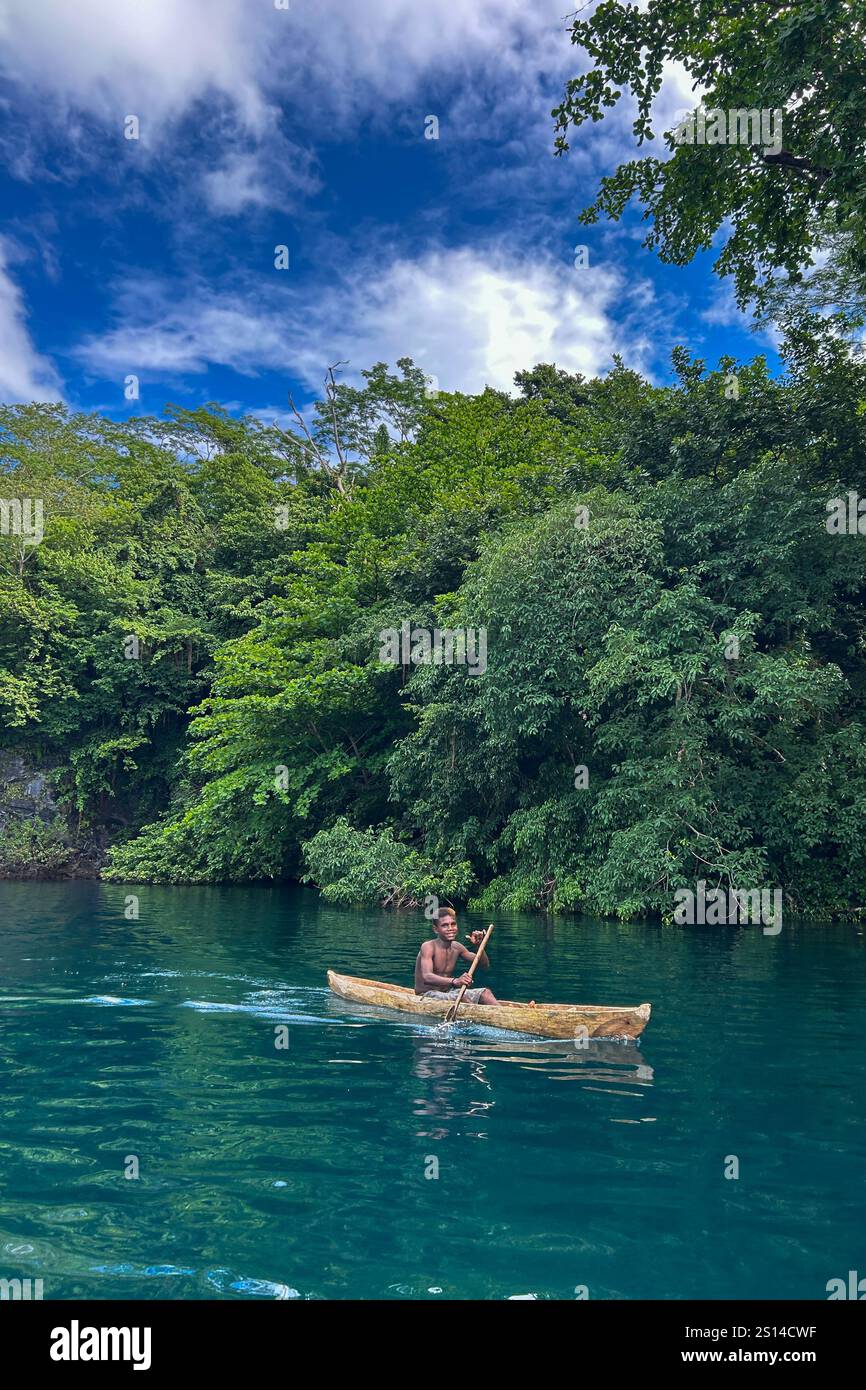 Residents of Vitu Islands in their traditional dugout canoes, Garove ...