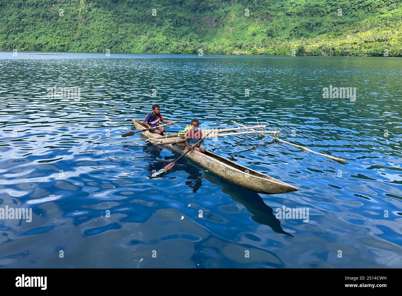 Residents of Vitu Islands in their traditional dugout canoes, Garove ...