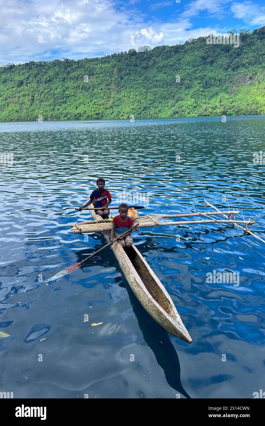 Residents of Vitu Islands in their traditional dugout canoes, Garove ...