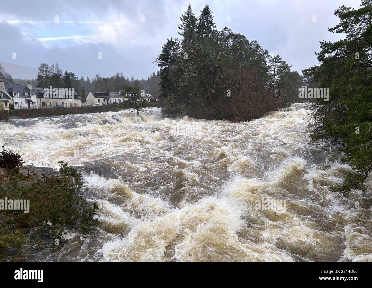 White water at the Falls of Dochart in Killin, Stirlingshire, as snow ...