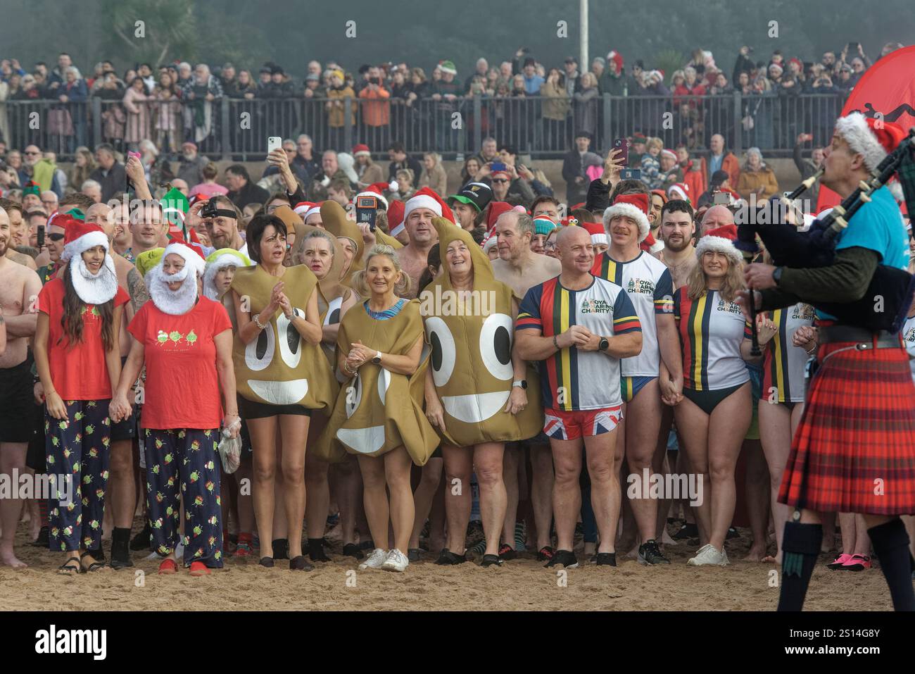 Hundreds of people, many in festive, sewage protest and charity support ...