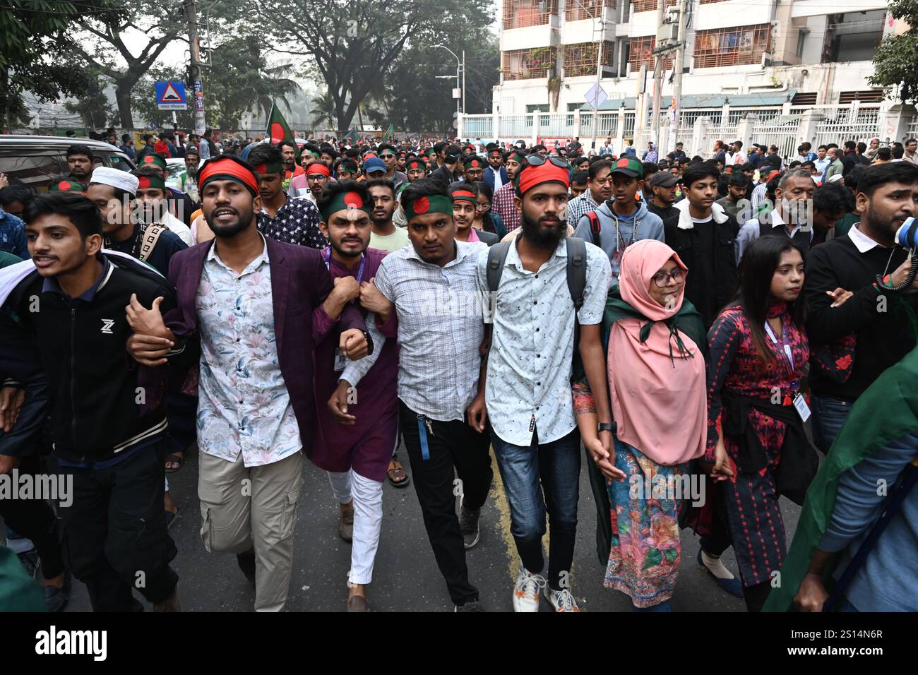 Dhaka, Bangladesh. 31st Dec, 2024. Students and supporters shout slogans during the 'March for ...