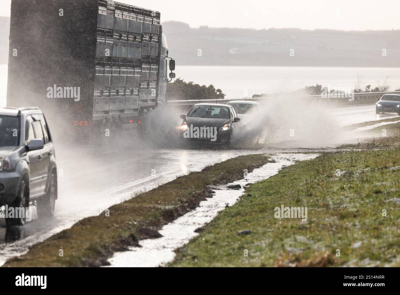 Vehicles drive on the A9 in Inverness, as snow, rain and wind warnings ...