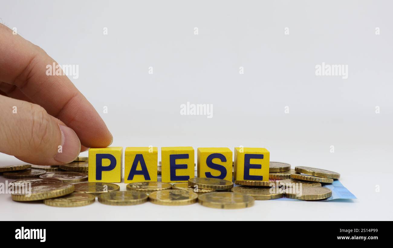Single word (PAESE) in Italian, with euro coins and copy space ...