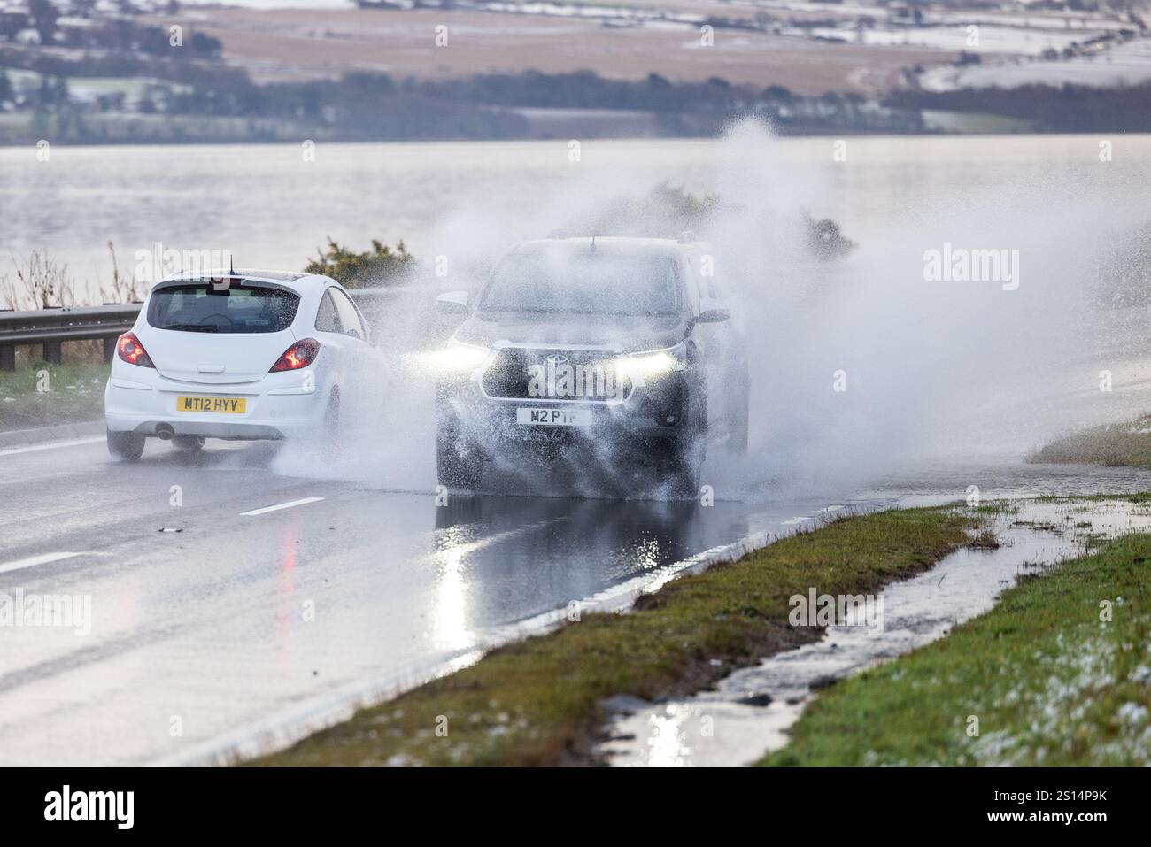 Vehicles drive on the A9 in Inverness, as snow, rain and wind warnings ...