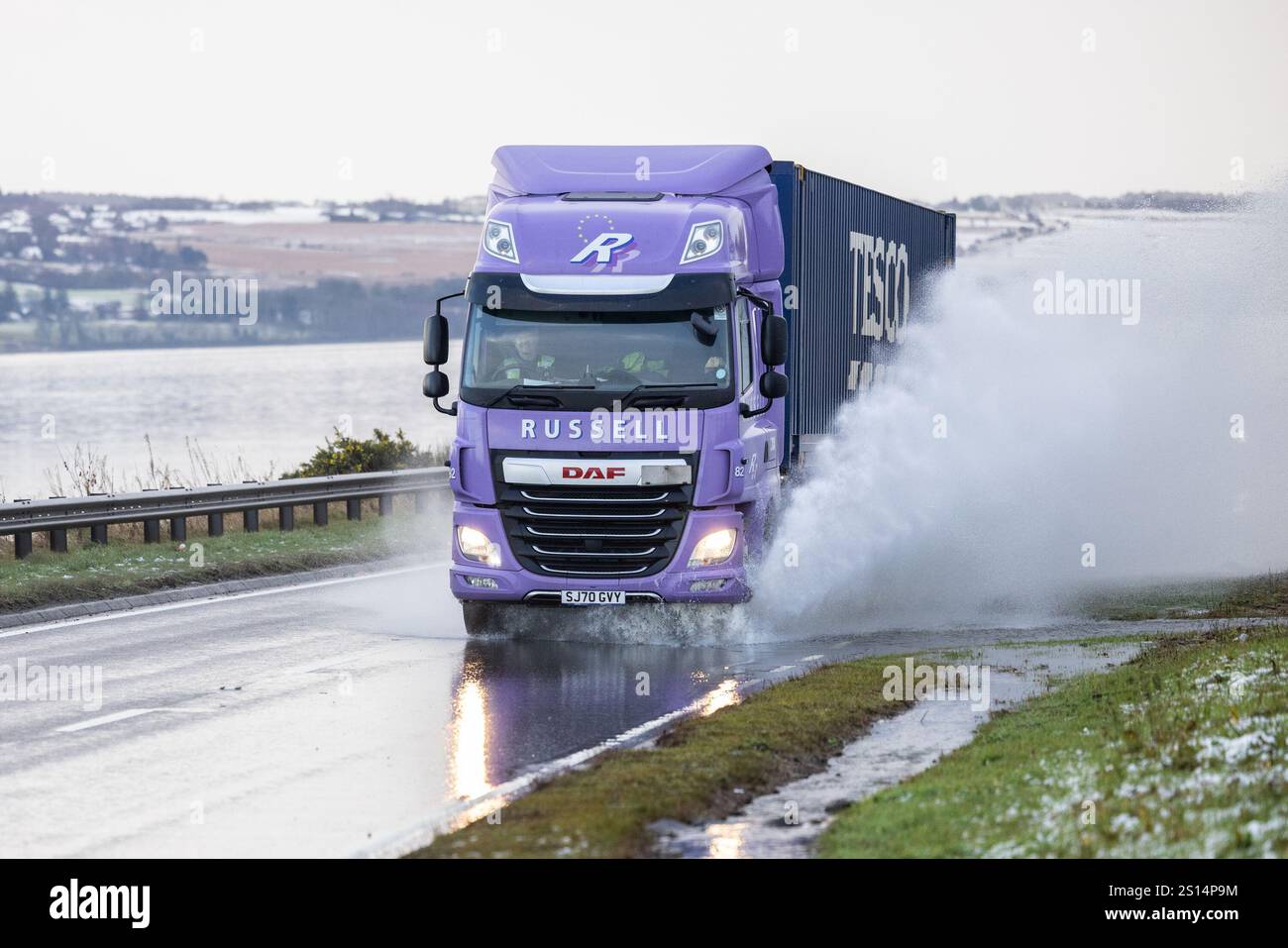 Vehicles drive on the A9 in Inverness, as snow, rain and wind warnings ...