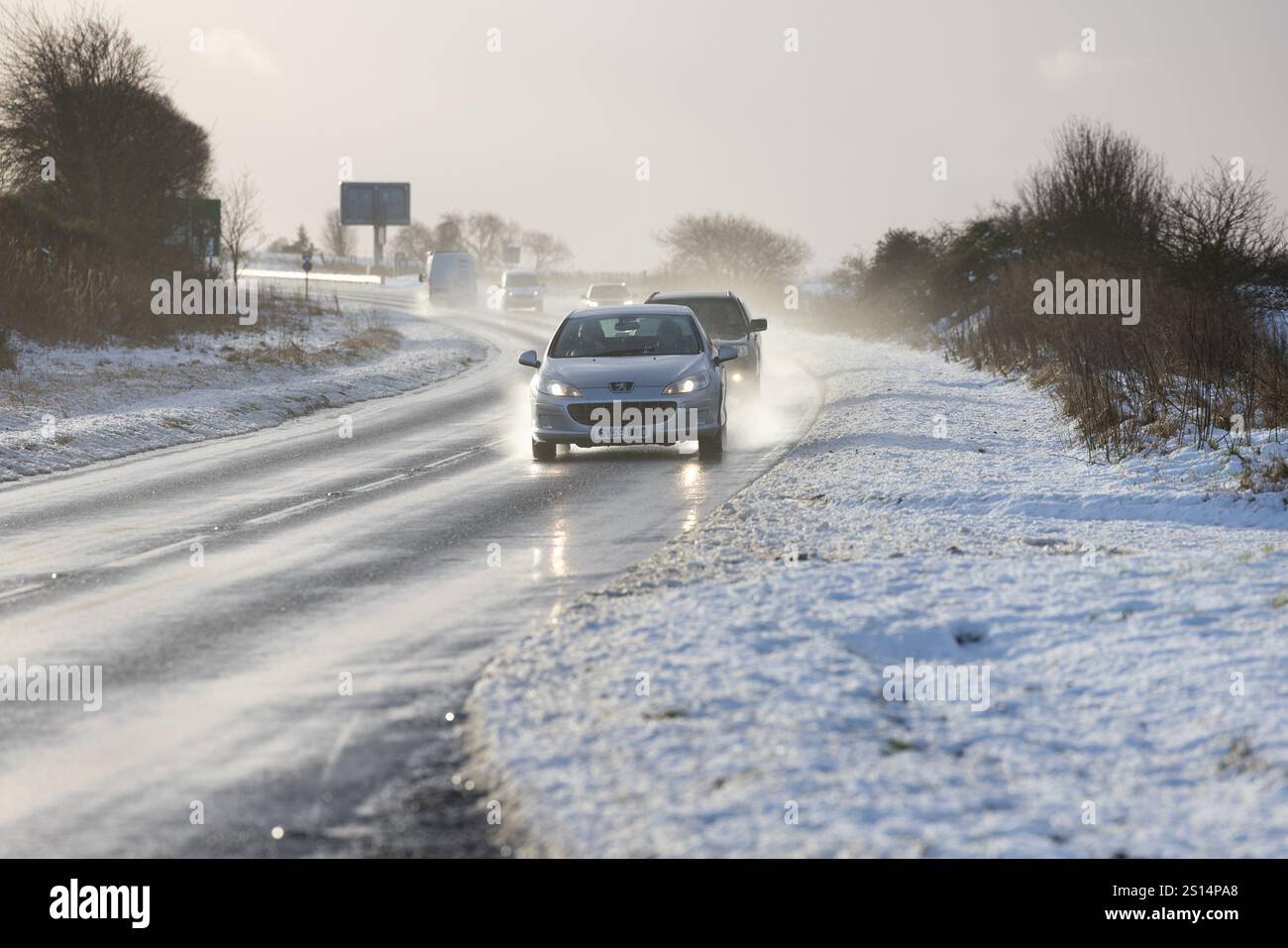 Vehicles drive on the A9 in Inverness, as snow, rain and wind warnings ...