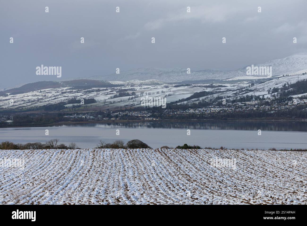 Snow in Dingwall, as snow, rain and wind warnings are in force and are ...
