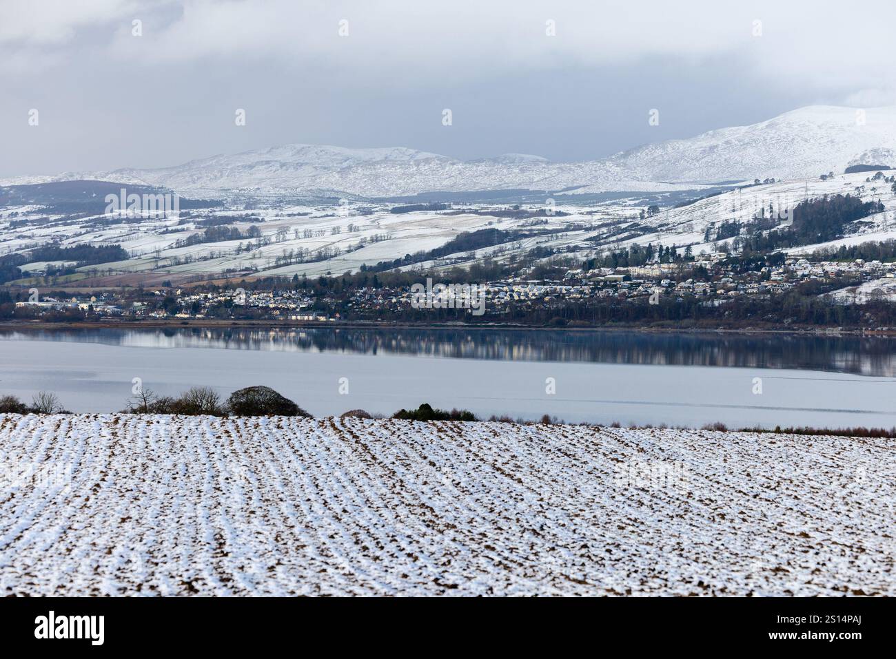 Snow in Dingwall, as snow, rain and wind warnings are in force and are ...