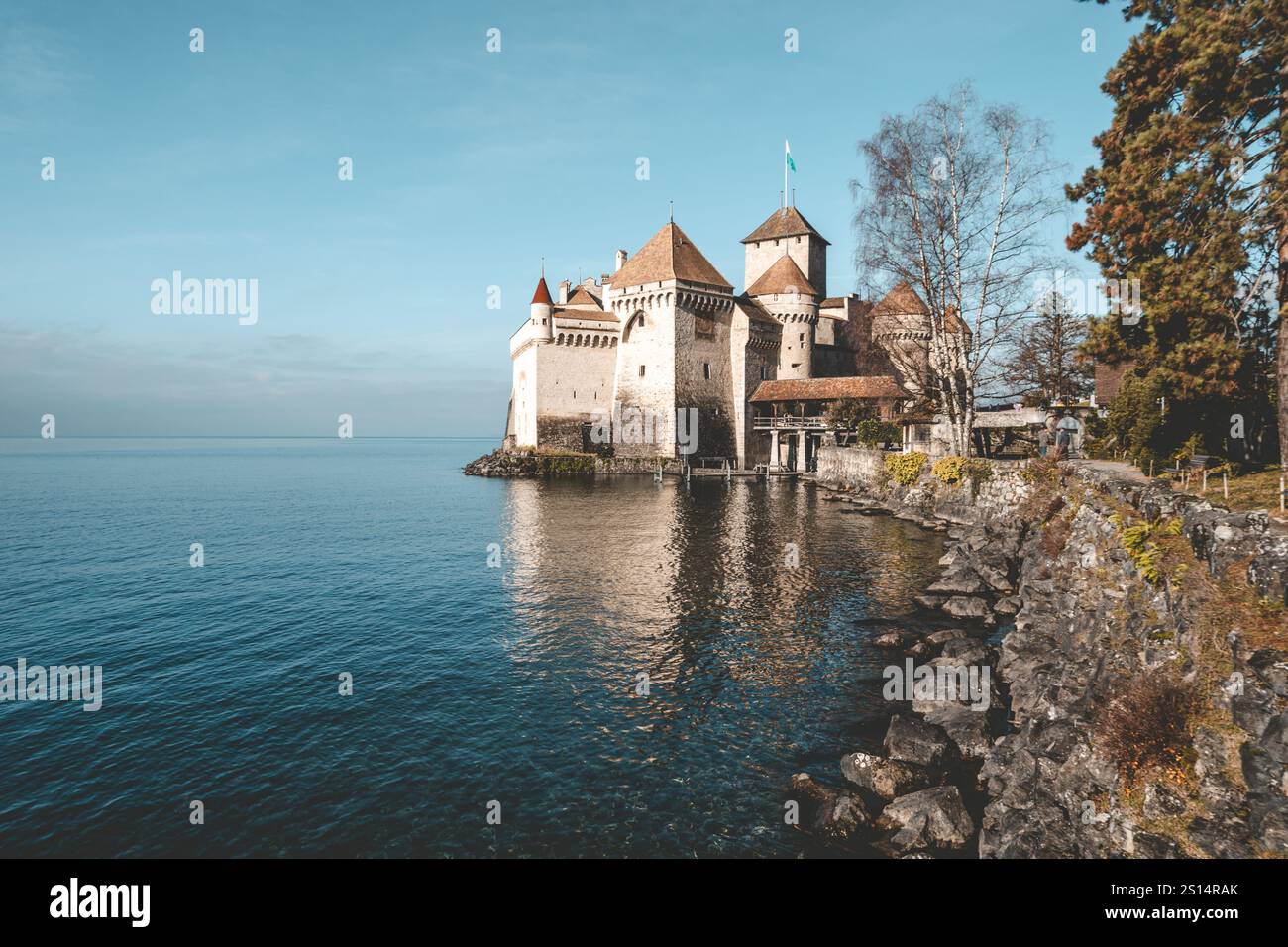 Chillon Castle or Chateau de Chillon is a famous castle located on Lake ...