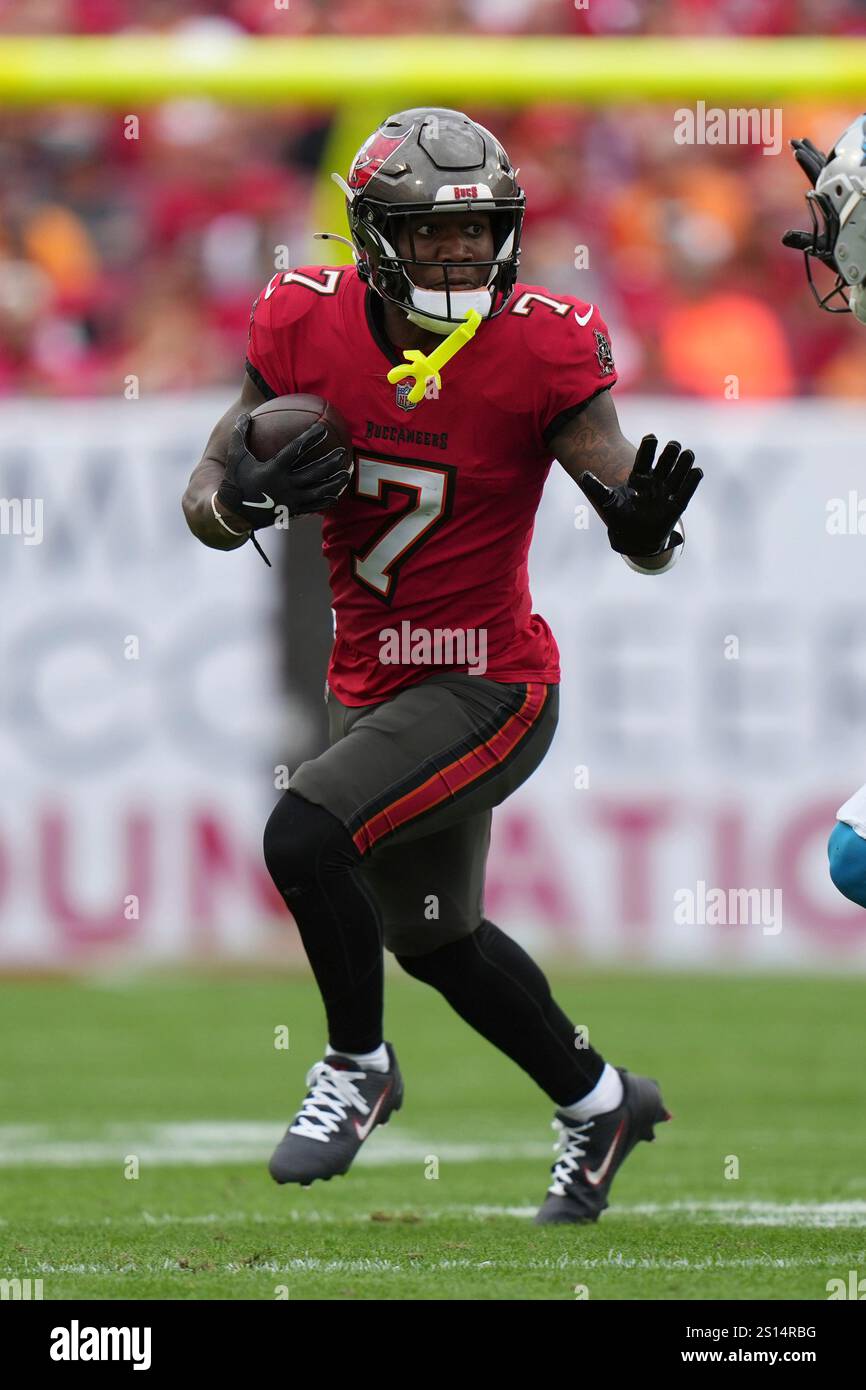 Tampa Bay Buccaneers running back Bucky Irving (7) rushes with the ball ...