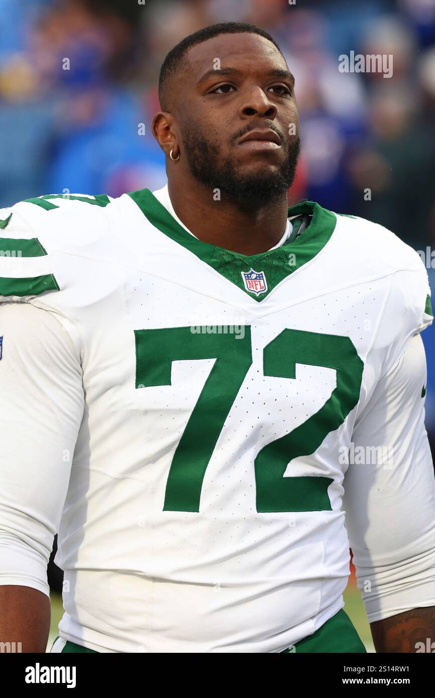 New York Jets defensive end Micheal Clemons (72) walks off field prior ...