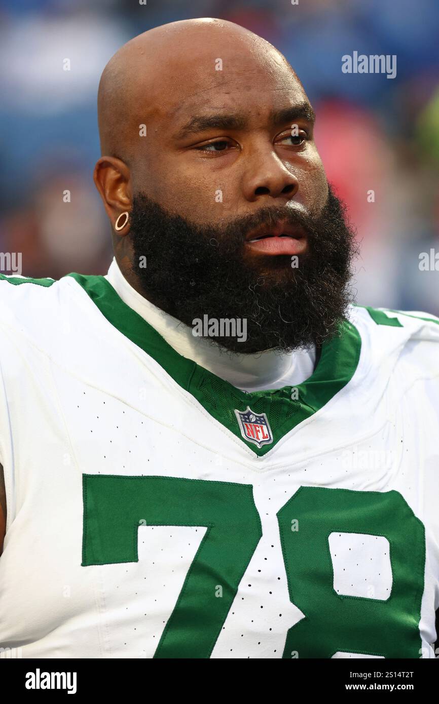 New York Jets offensive tackle Morgan Moses (78) walks off field prior ...