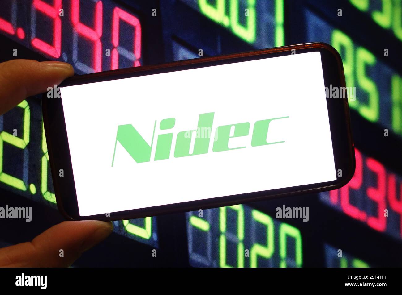 In this photo illustration, the Nidec company logo is seen displayed on ...