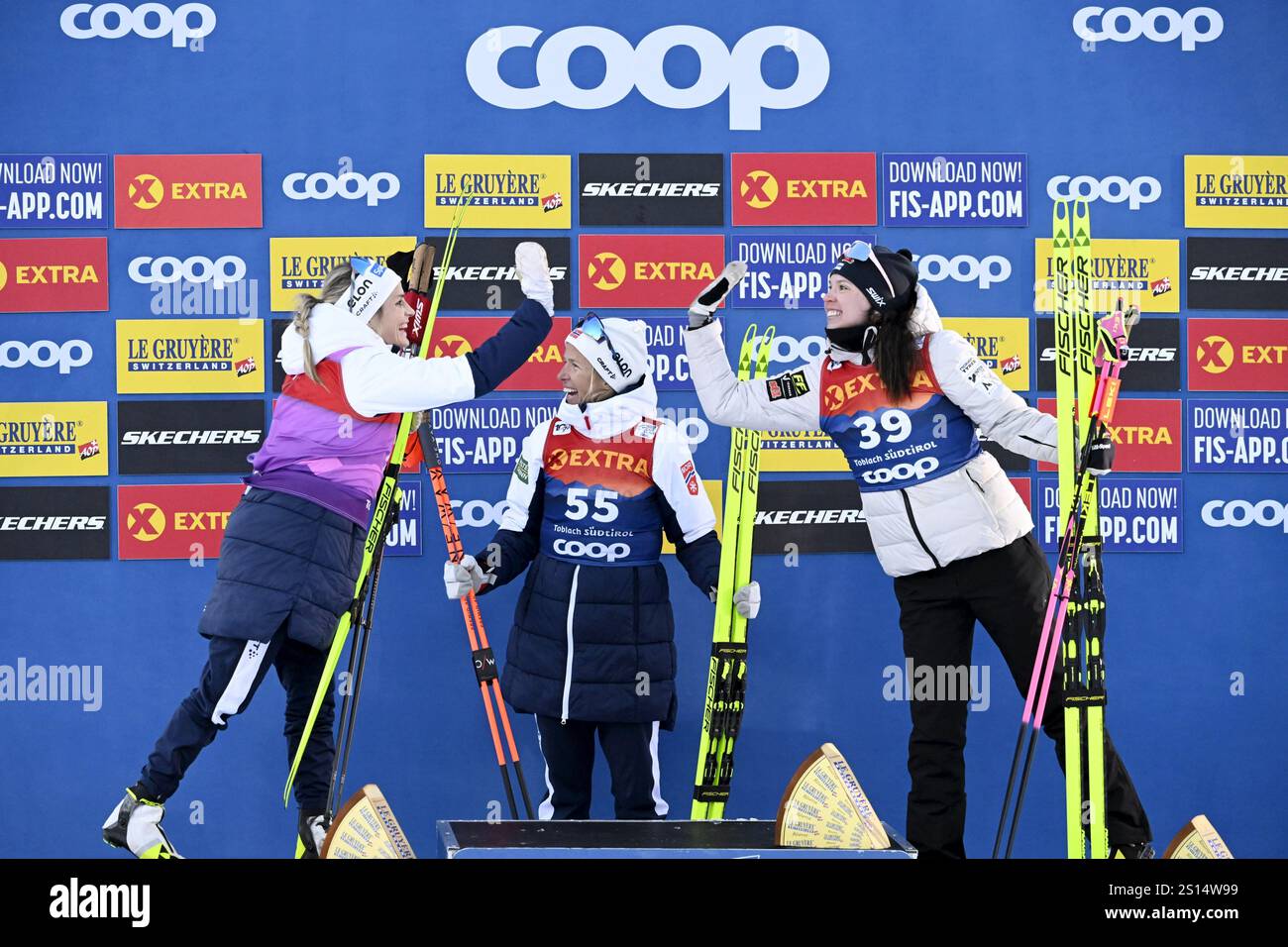 Toblach, Italy. 31st Dec, 2024. Winner Astrid Öyre Slind of Norway (C), second placed Therese ...