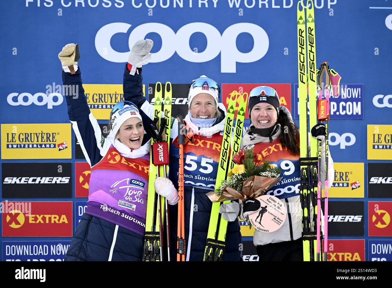 Toblach, Italy. 31st Dec, 2024. Winner Astrid Öyre Slind of Norway (C), second placed Therese ...