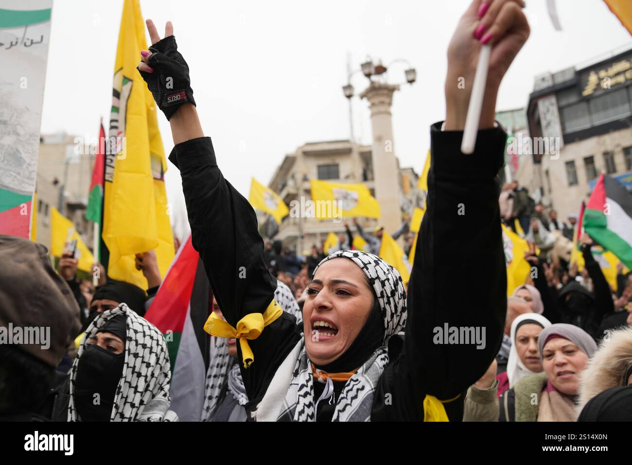 Fatah supporters chant slogans during a rally and a military parade to ...