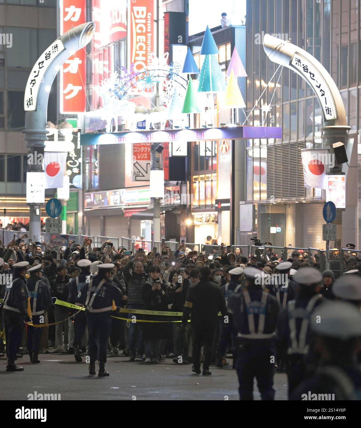 On January 1, 2025, many pedestrians reach the New Year around the ...