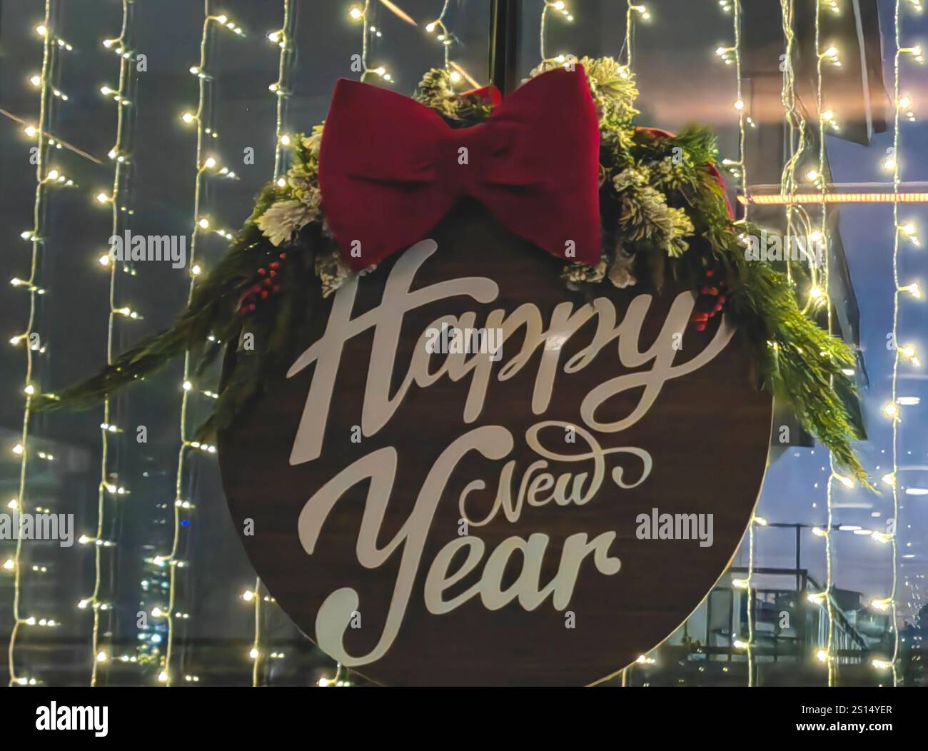 Festive Glow: Happy New Year Signage with Ribbon and Lights Stock Photo ...