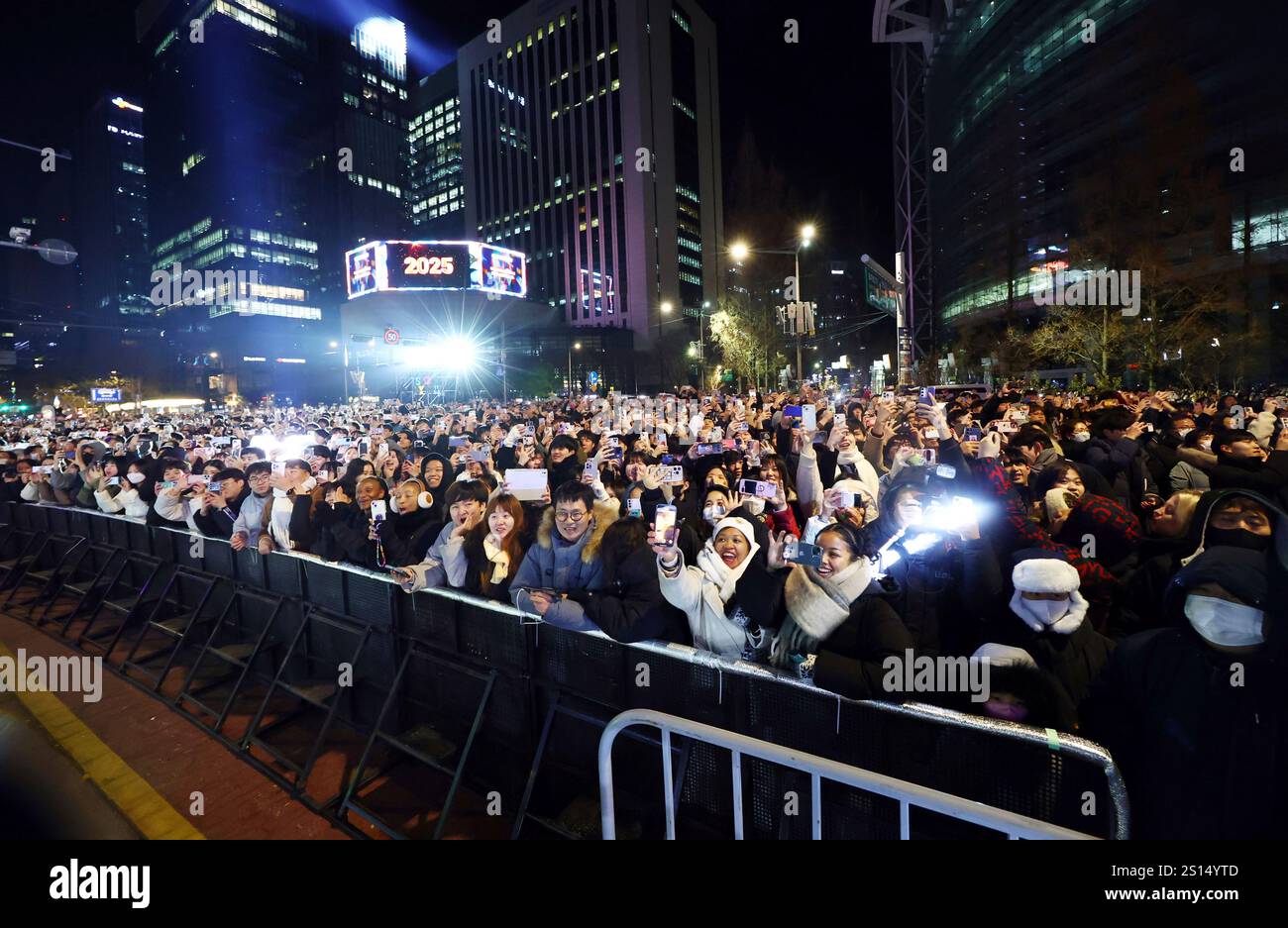 People gather during a countdown event at the Bosingak pavilion in ...
