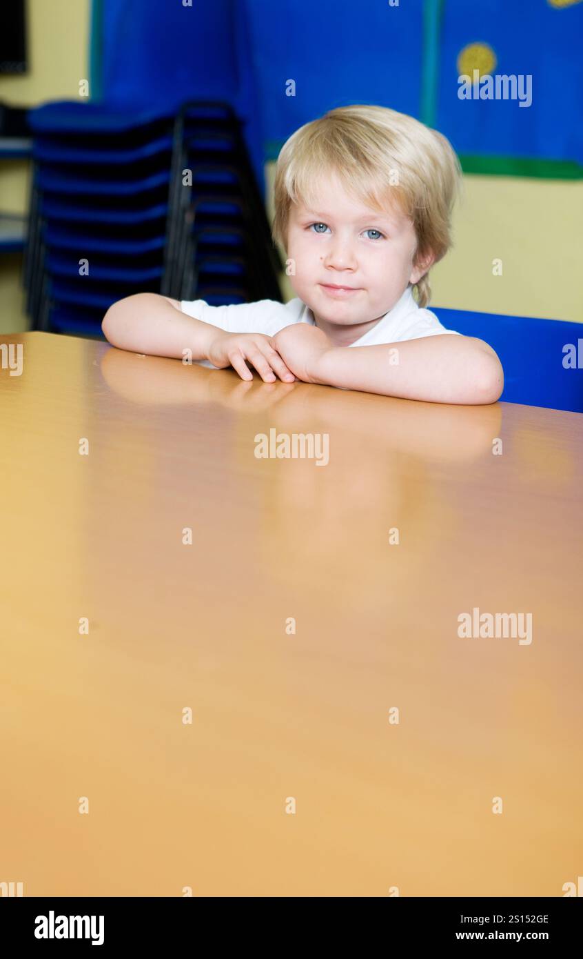 Elementary School: Eager to Learn. A young boy waiting patiently for ...